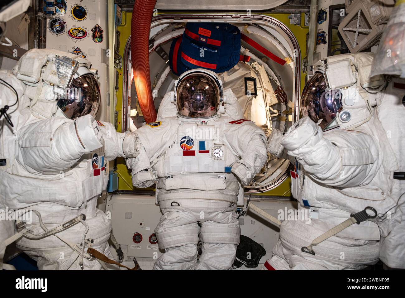 iss070e021451 (Nov. 7, 2023) --- Three near-assembled spacesuits, with ...