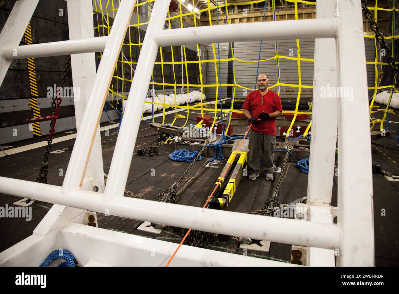 An Orion recovery team member makes preparations for Orion's splashdown ...