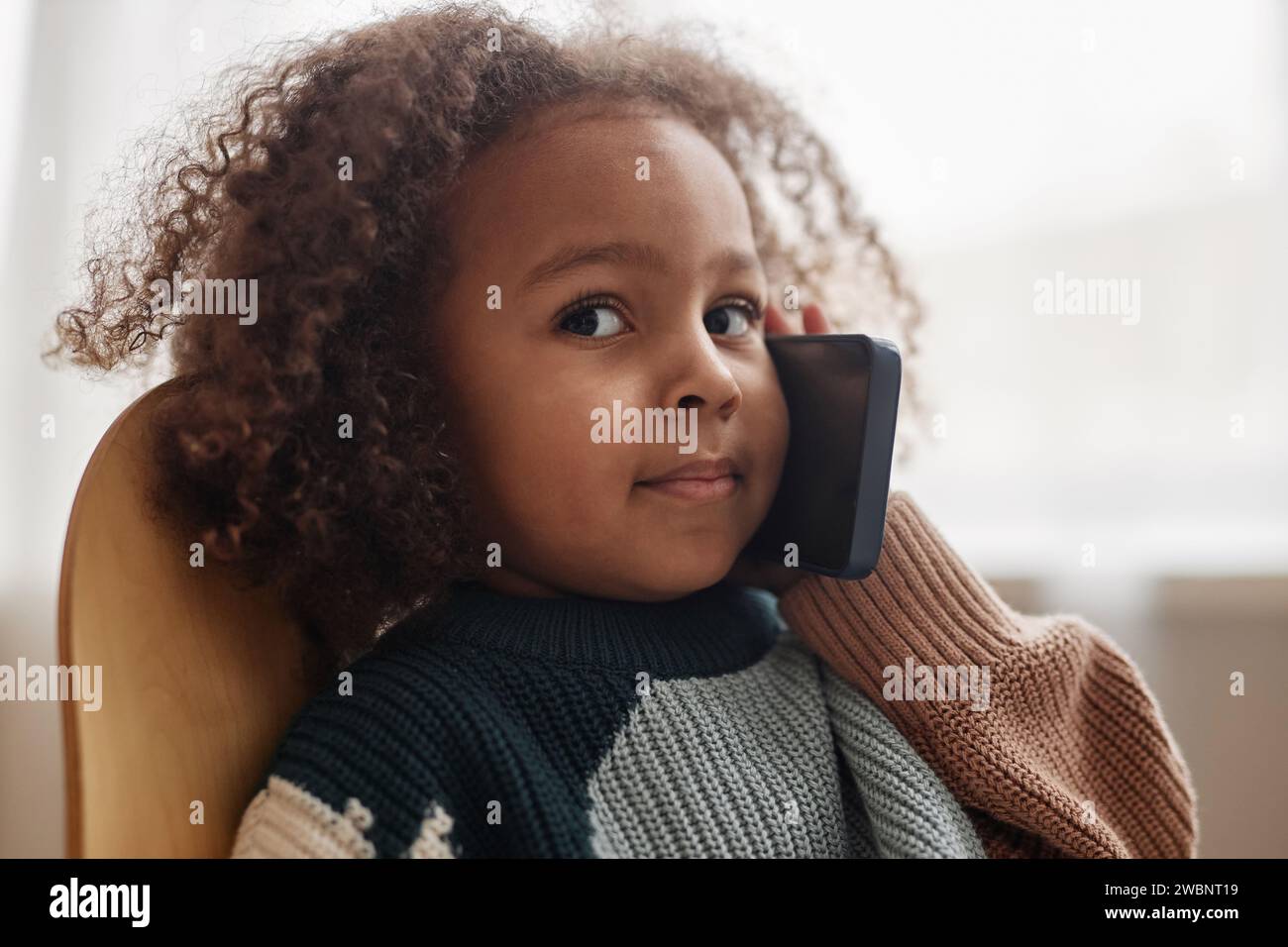 Girl Child Talking on Phone Stock Photo - Alamy
