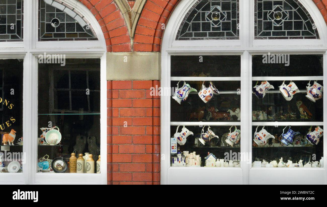 Window shopping in Brecon High Street: the shop windows are filled with ...