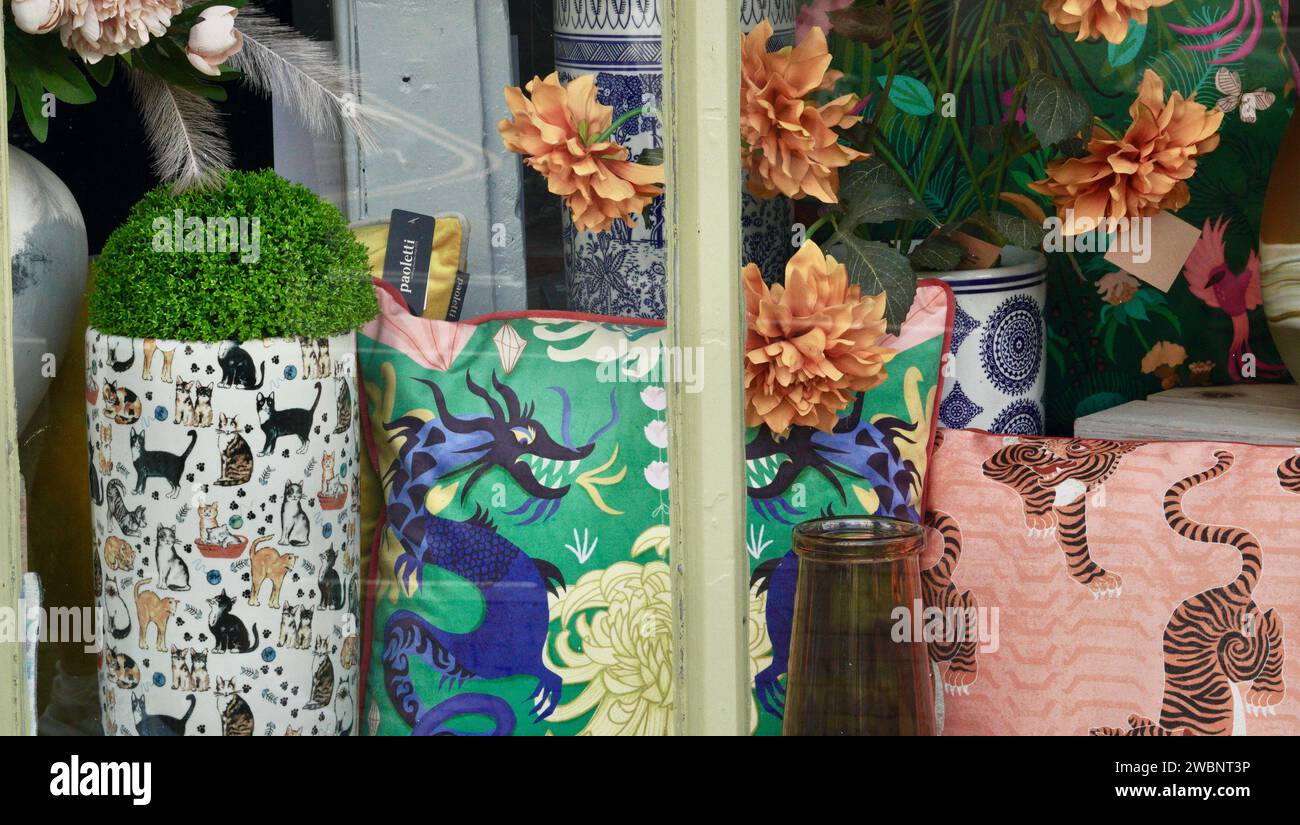 Window shopping in Brecon High Street: the shop windows are filled with ...