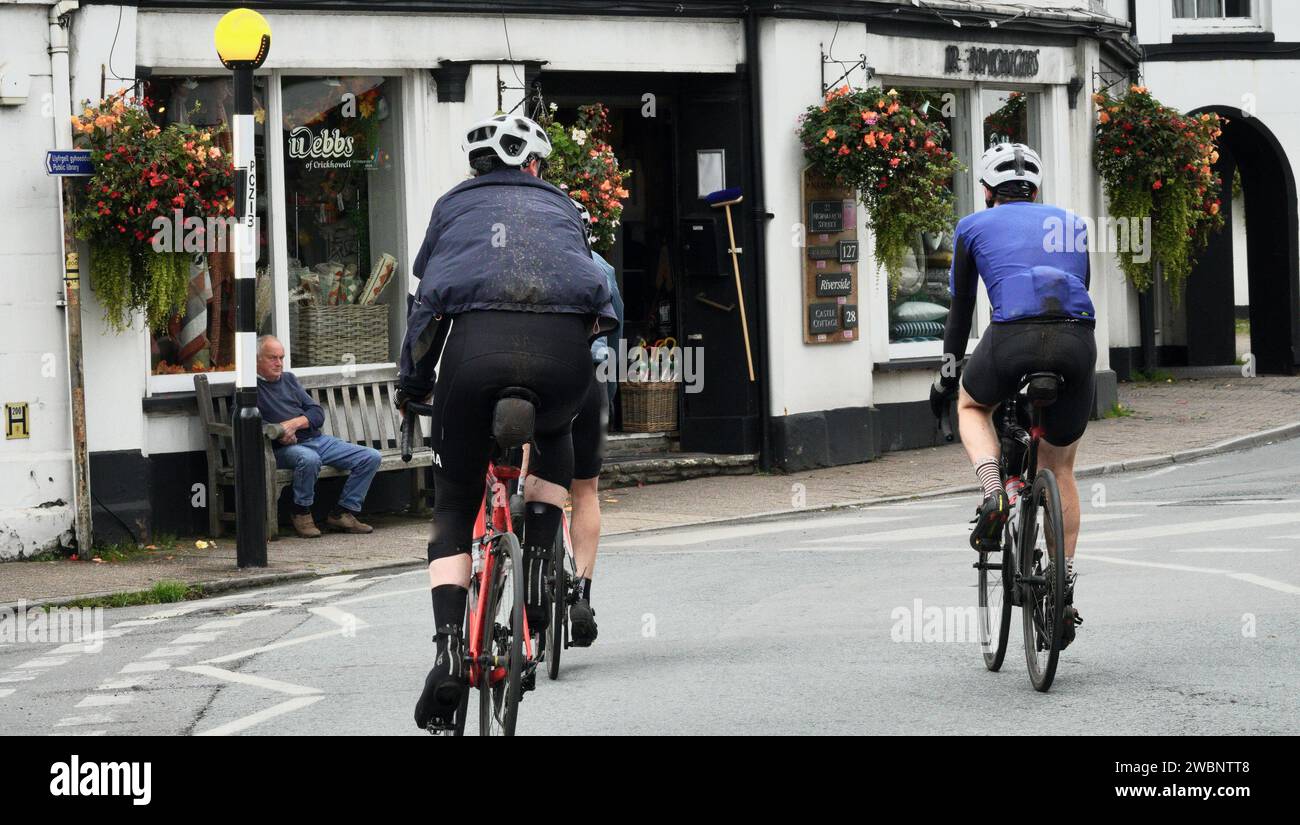 Mountain bike riders travel through the small town of Crickhowell on ...