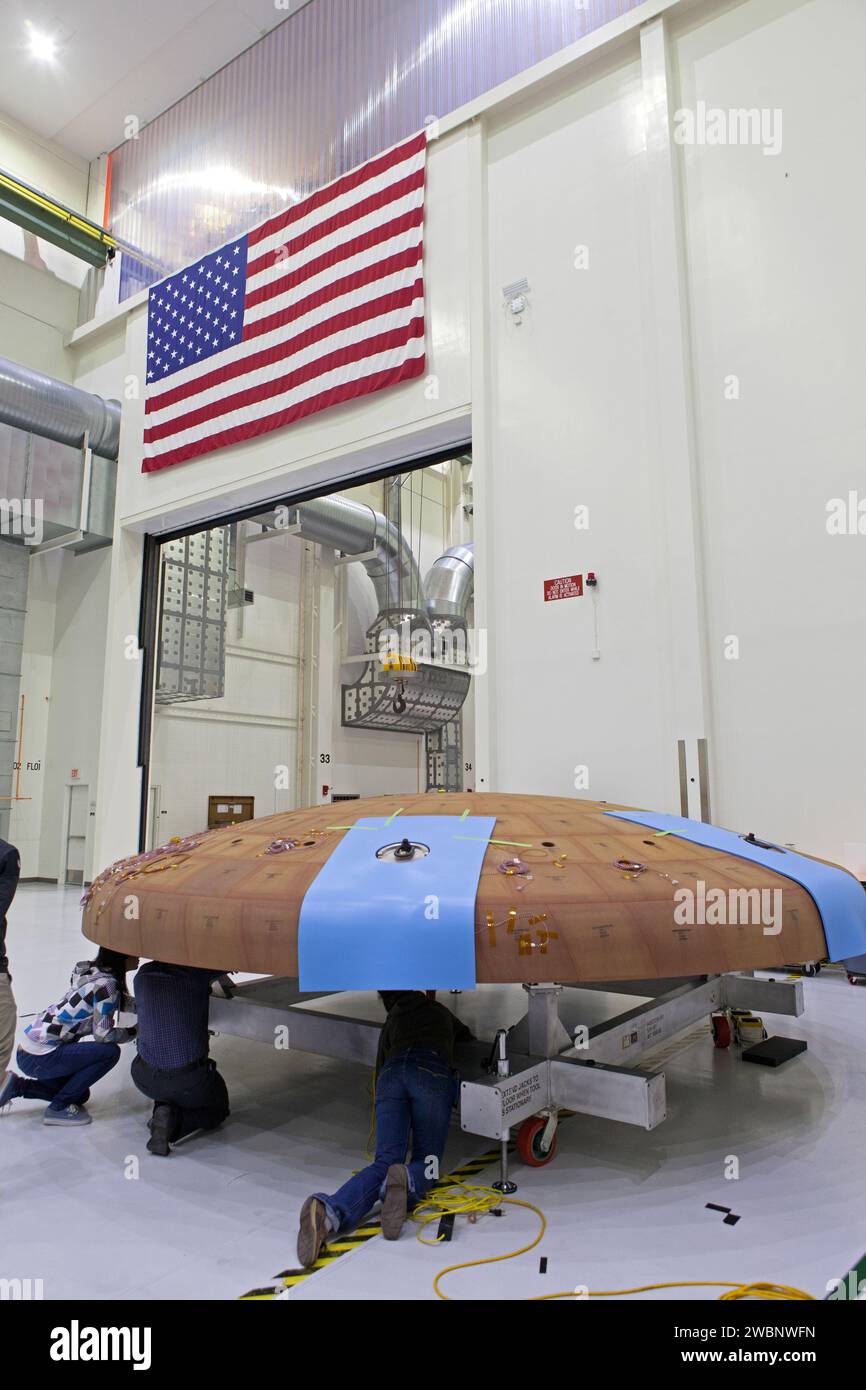Lockheed Martin engineers and technicians prepare the Orion heat shield ...
