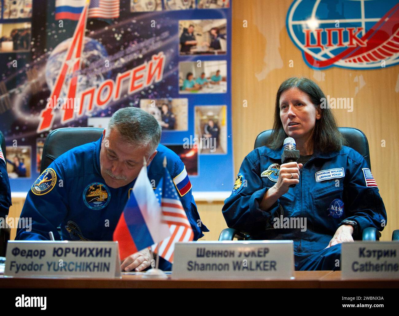 Expedition 24 Flight Engineer Shannon Walker answers a reporter’s ...
