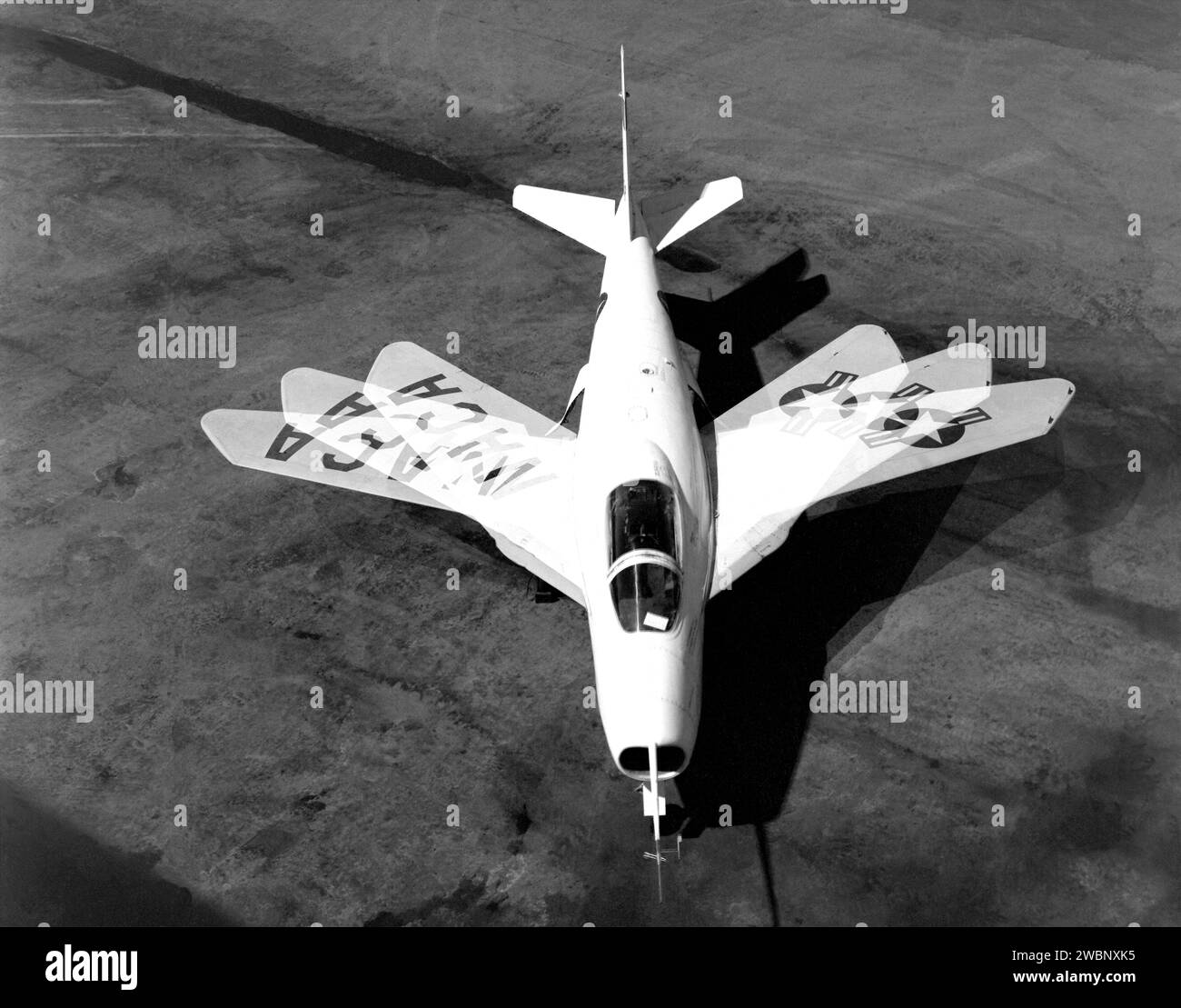 The Bell X-5 swings its wings in this multiple exposure photograph ...