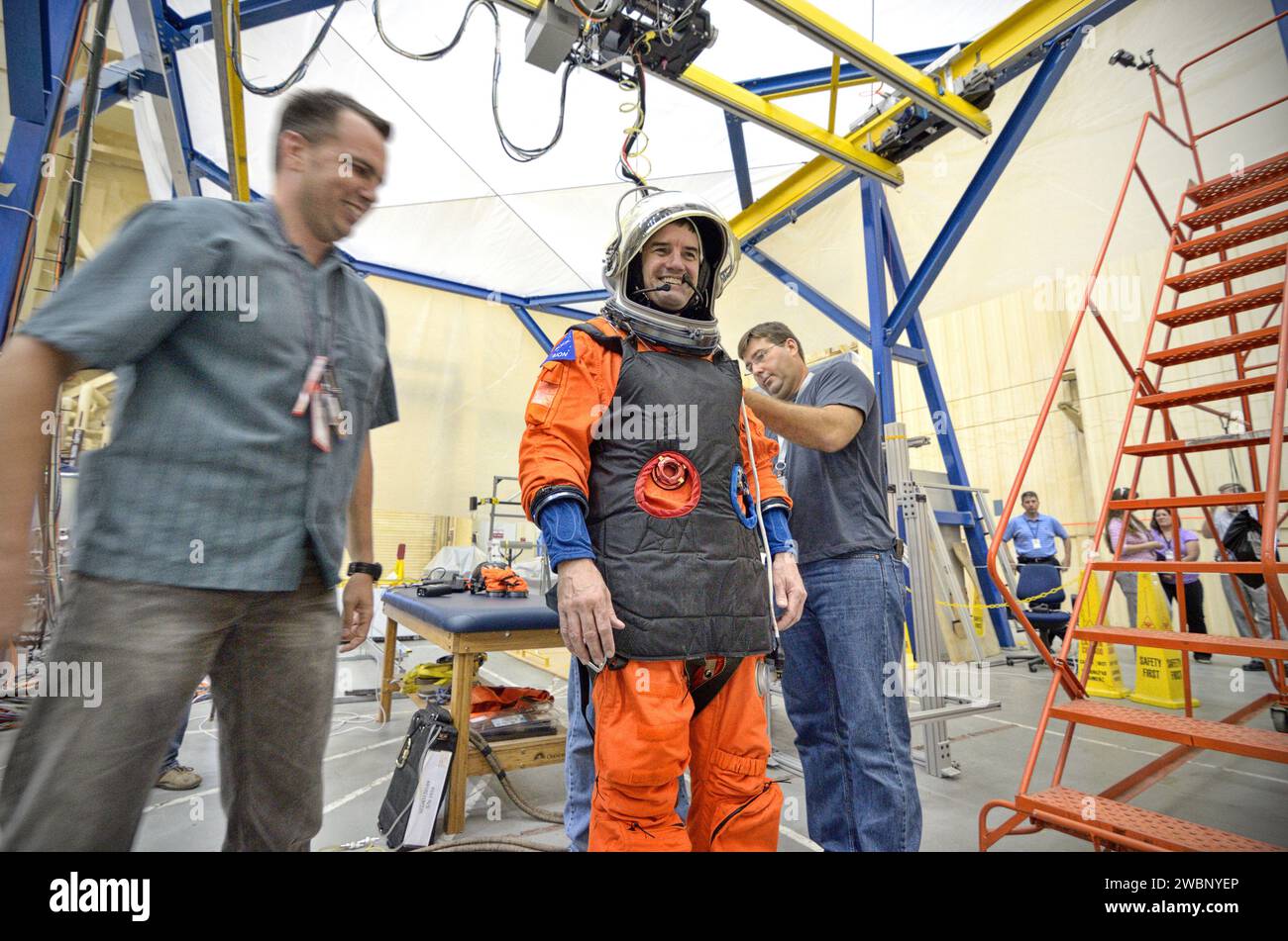 Astronaut Rex Walheim uses the Active Response Gravity Offload System ...