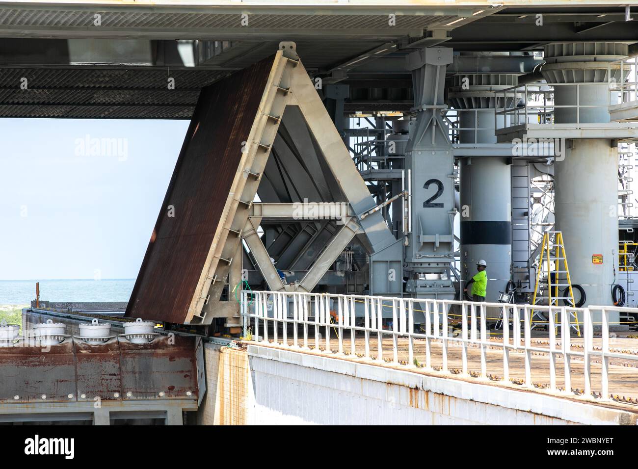 A close-up view of the base of one of the side flame deflectors ...