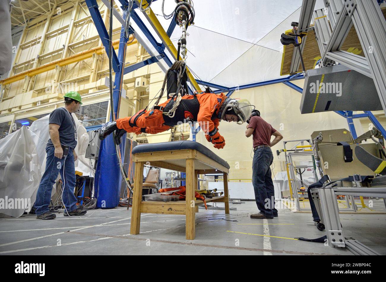 Astronaut Rex Walheim uses the Active Response Gravity Offload System ...