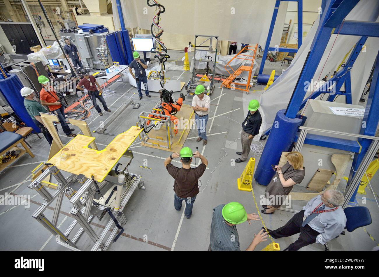 Astronaut Rex Walheim uses the Active Response Gravity Offload System ...