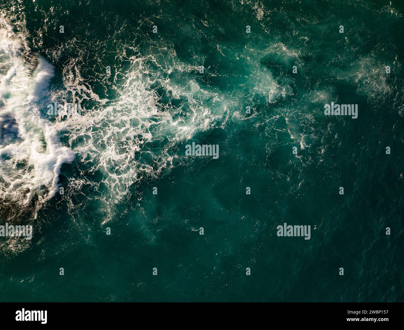 Aerial view of Waves crashing on seashore,Sea surface ocean waves ...