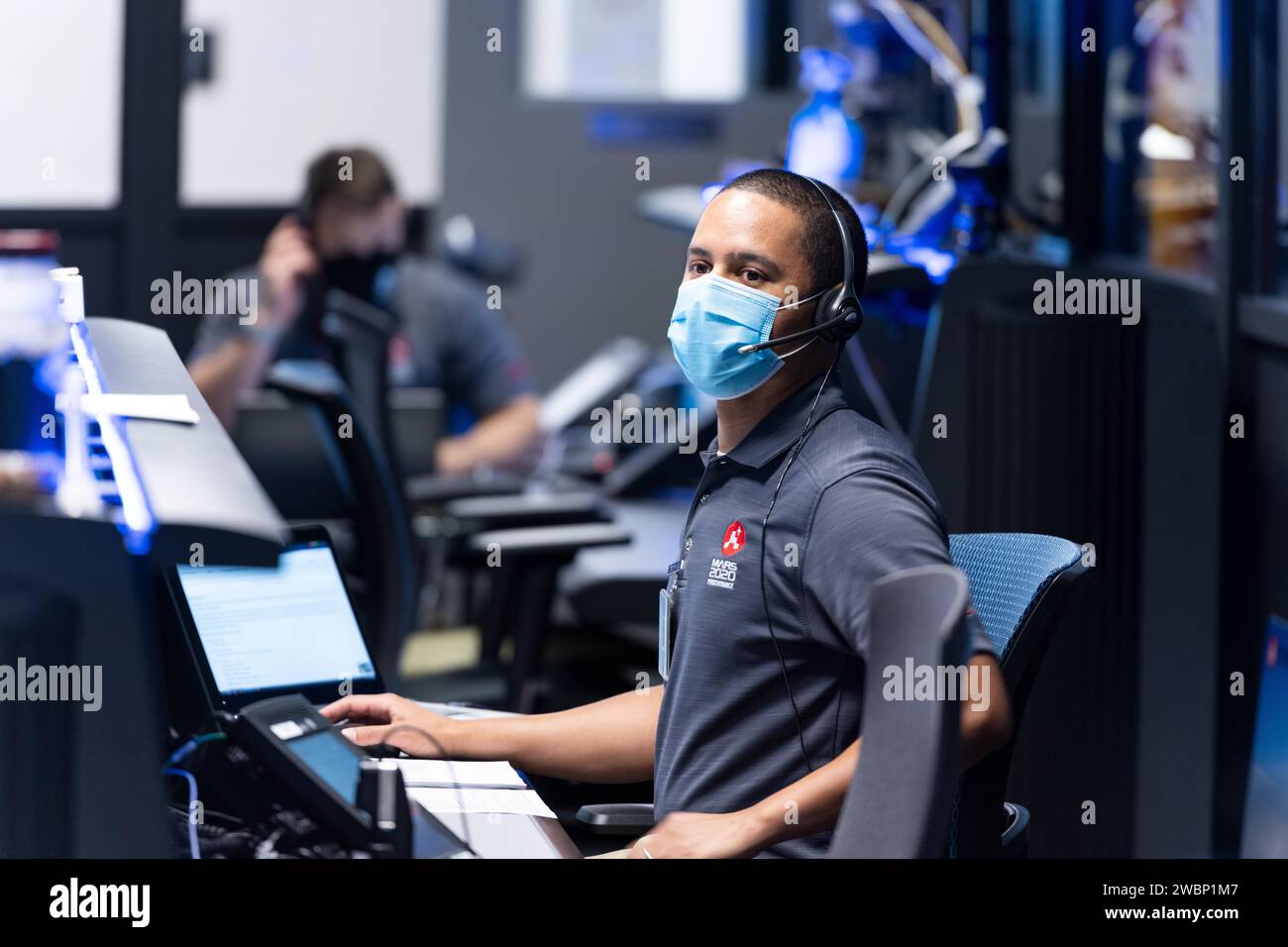 Matt Smith, flight director at NASA's JPL, monitored data during the ...