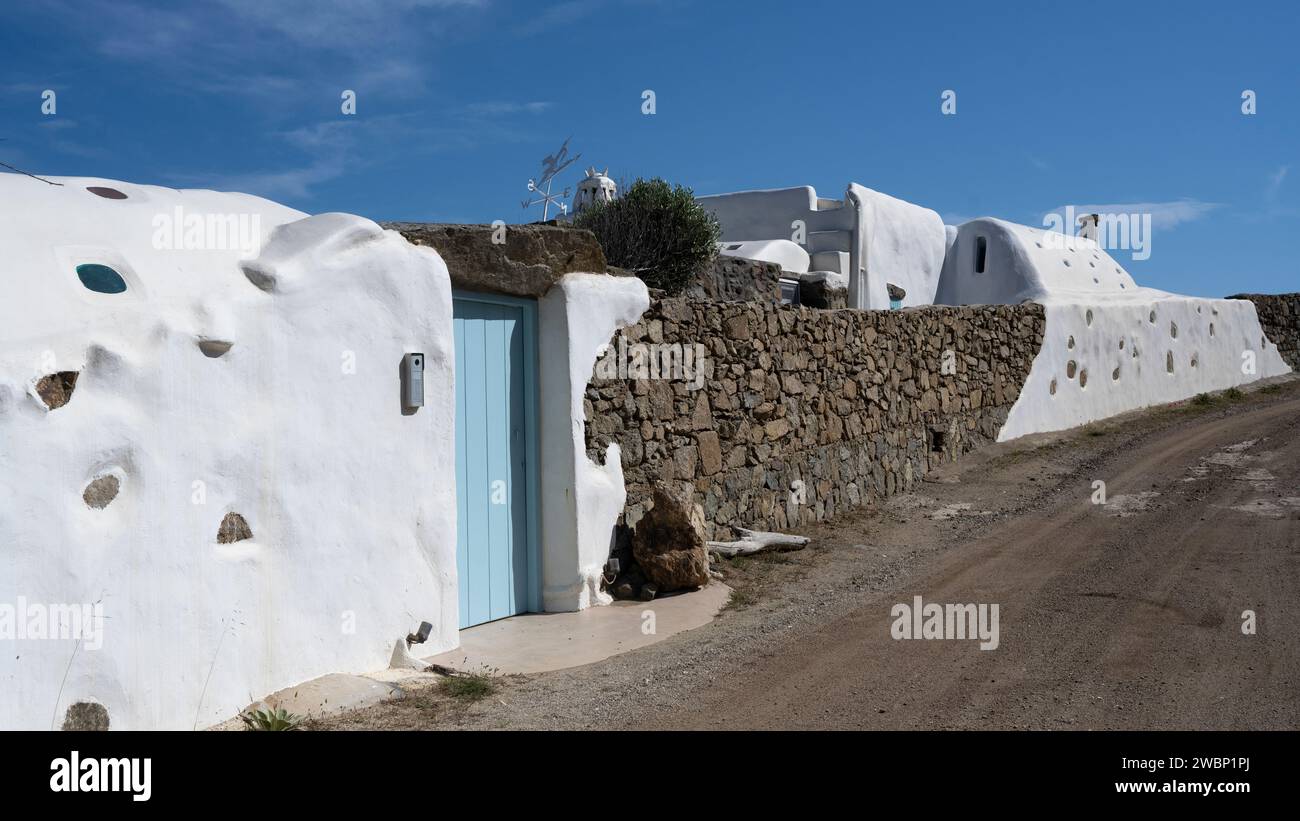 Stone wall along a roadway on Mykonos Greece Stock Photo - Alamy