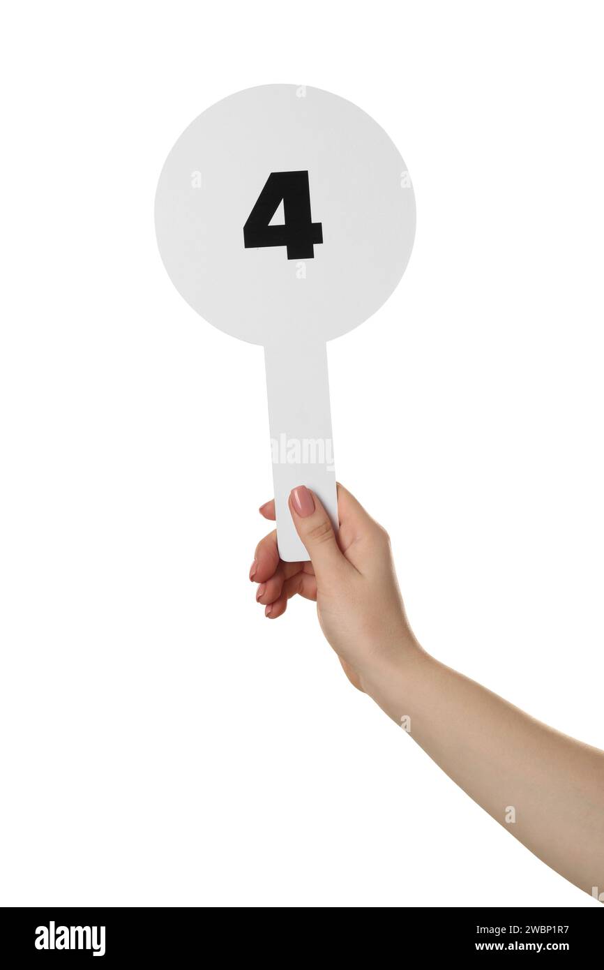 Woman holding auction paddle with number 4 on white background, closeup ...