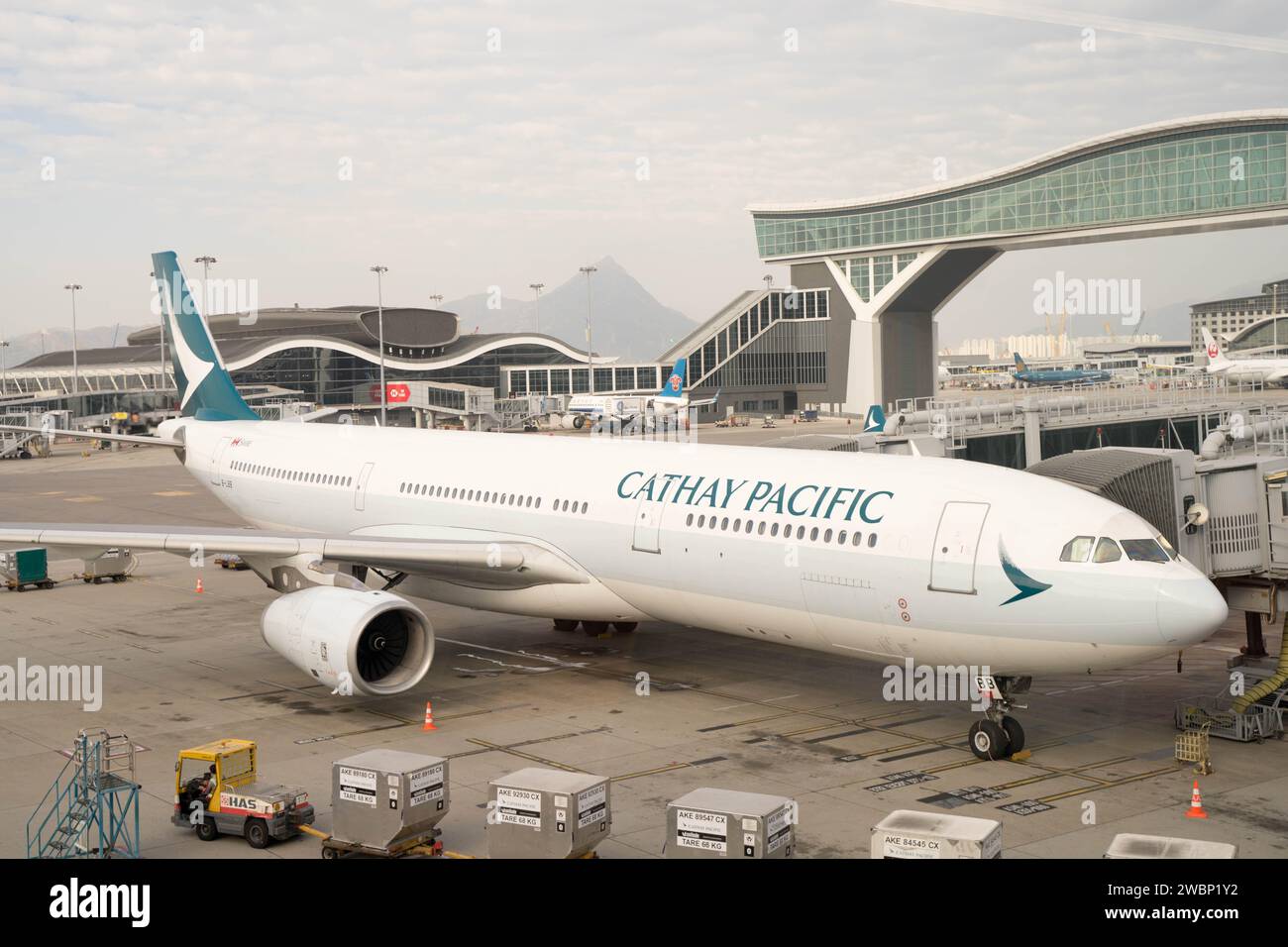 front to back view of Cathay Pacific aircraft parked on tarmac apron at ...
