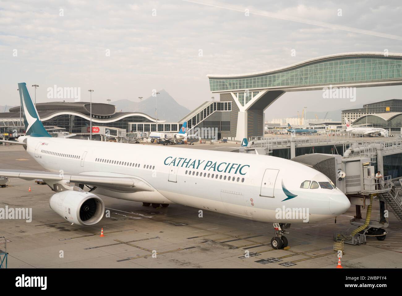 front to back view of Cathay Pacific aircraft parked on tarmac apron at ...