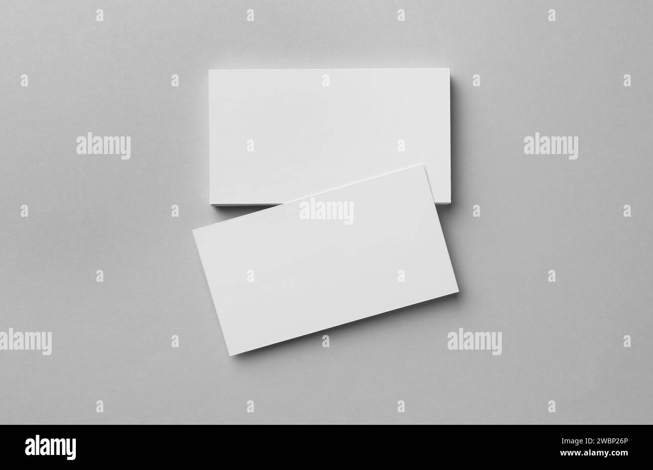 Blank business cards on light grey background, flat lay. Mockup for ...