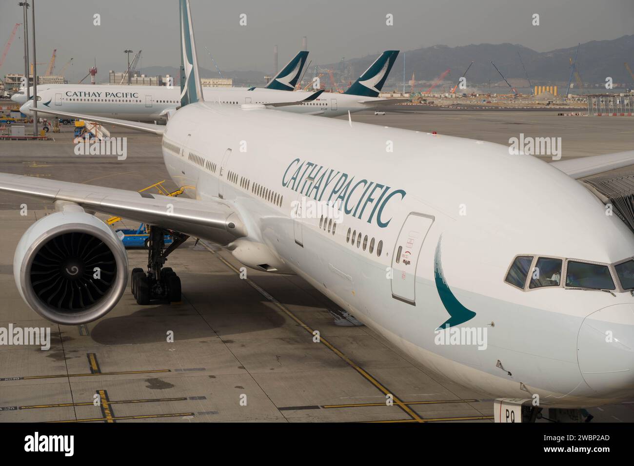 front to back side view of Cathay Pacific aircraft parked on tarmac ...