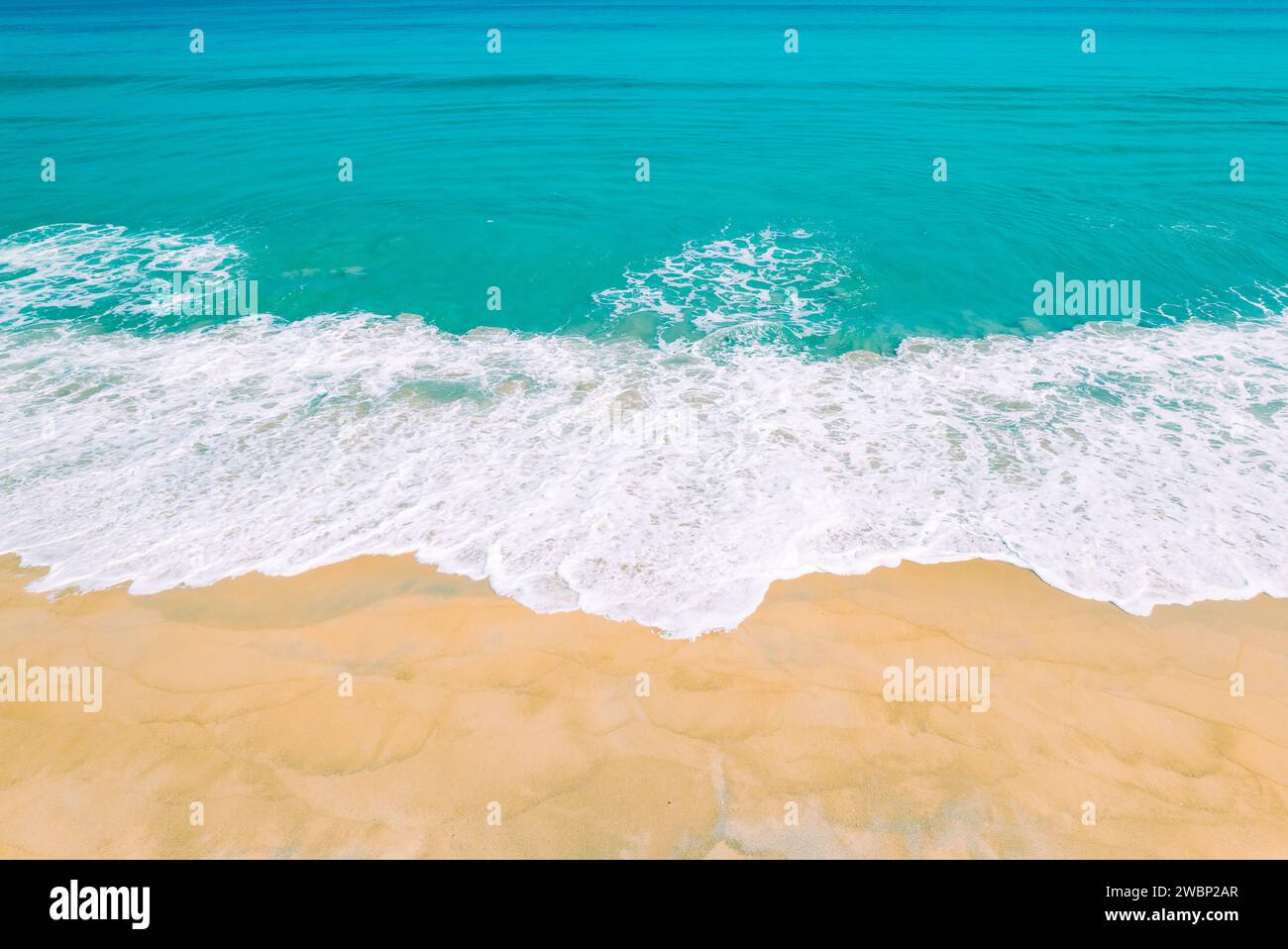 Top view beach with waves crashing on sandy shore,Beautiful waves sea ...