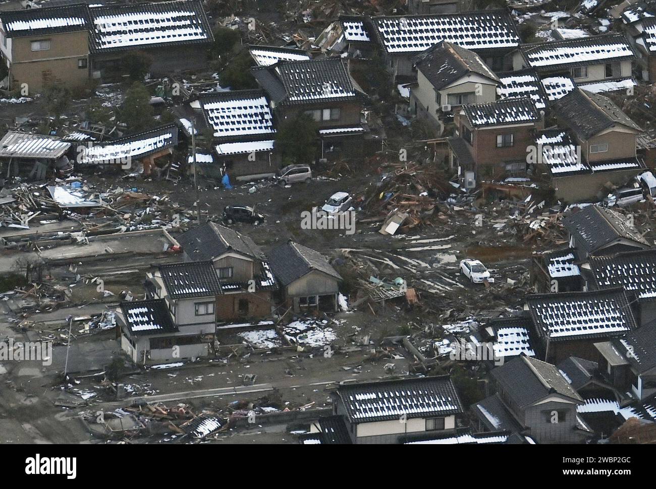 An aerial photo shows collapsed buildings in Suzu City, Ishikawa ...