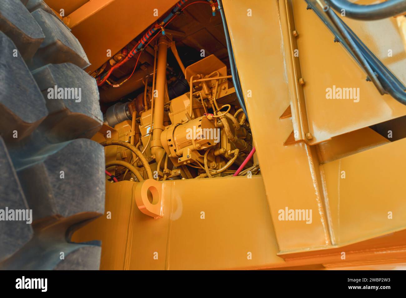 close up engine yellow mining truck and huge tire Stock Photo - Alamy