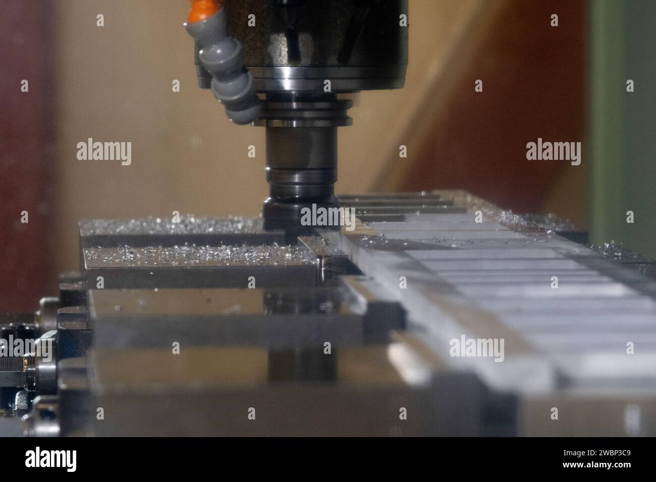A milling machine drills holes in the strut frame assembly for a 10 ...