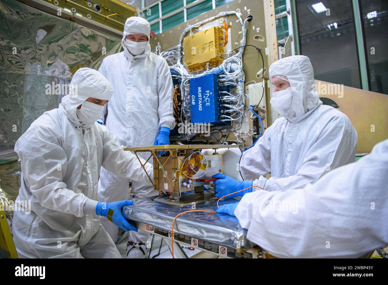 Technicians prepare to integrate the Hyper-Angular Rainbow Polarimeter ...