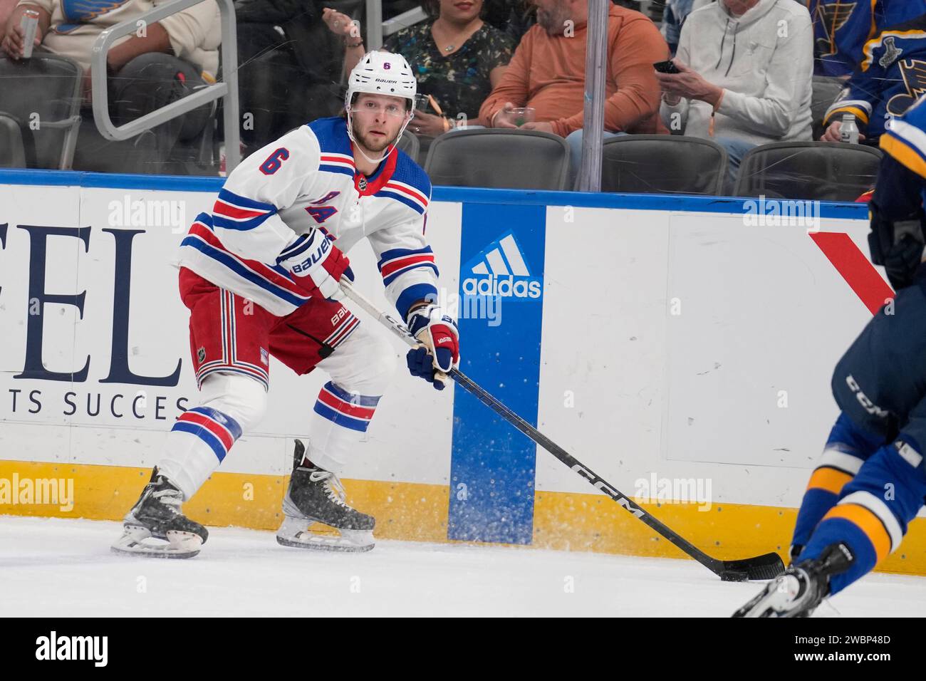 New York Rangers' Zac Jones controls the puck during the first period ...
