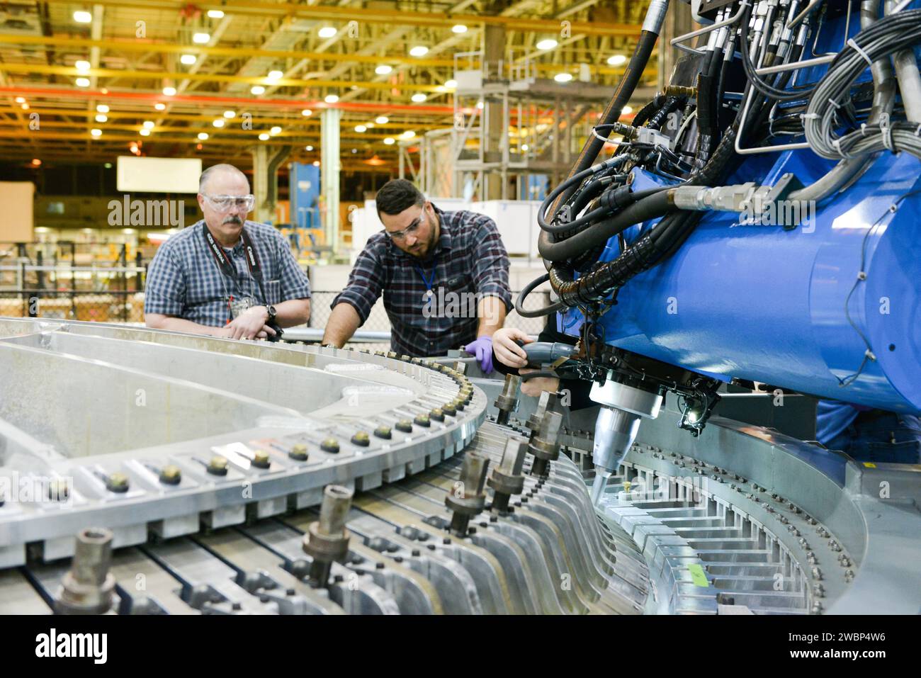 Technicians weld structural elements of the Orion EM2 spacecraft at ...
