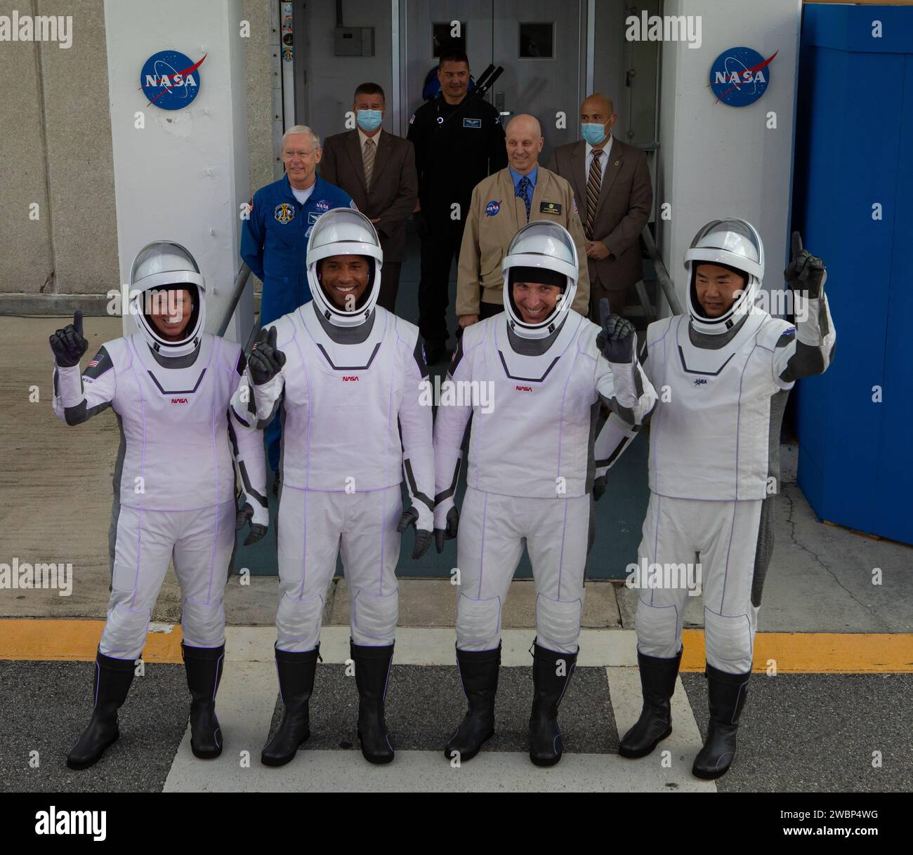 The NASA SpaceX Crew-1 astronauts emerge from the Neil Armstrong ...