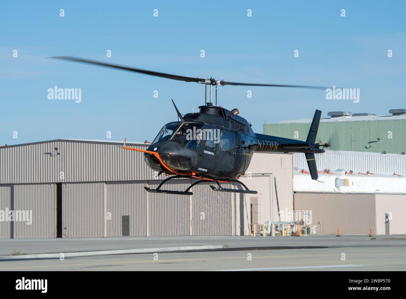 A Bell OH-58C Kiowa helicopter provided by Flight Research Inc. in ...