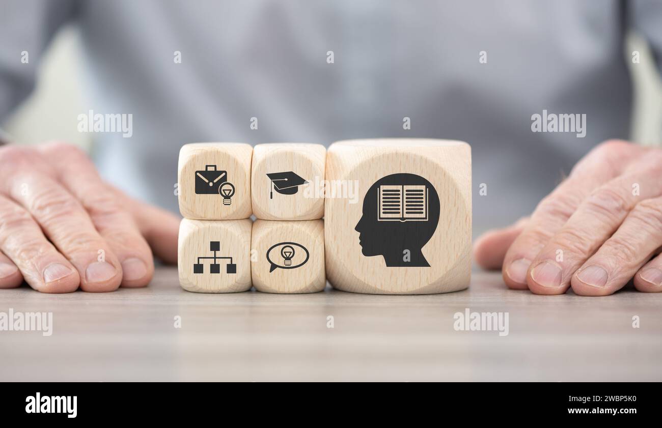 Wooden blocks with symbol of knowledge concept Stock Photo - Alamy