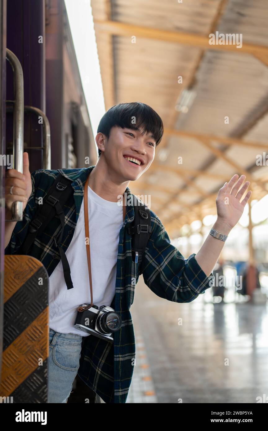 Person waving train station hi-res stock photography and images - Alamy