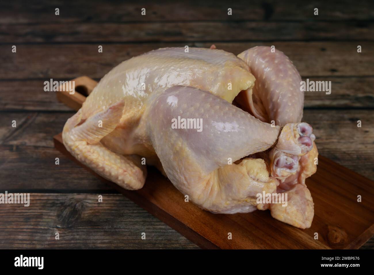 Getting raw turkey ready for cooking Stock Photo - Alamy