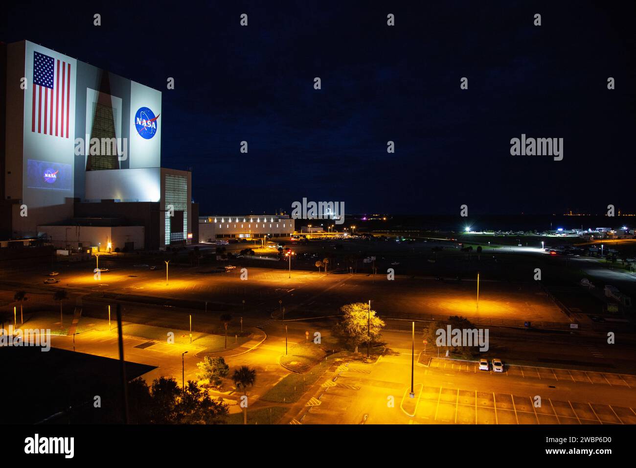 With a view of the iconic Vehicle Assembly Building at left, a SpaceX ...