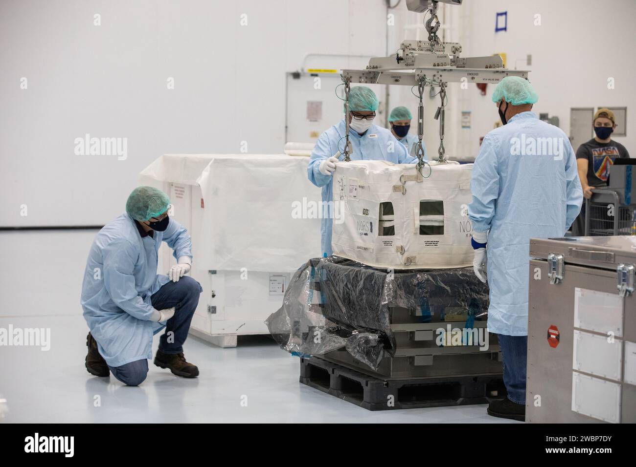 Technicians unpack and inspect a Nitrogen/Oxygen Recharge System (NORS ...