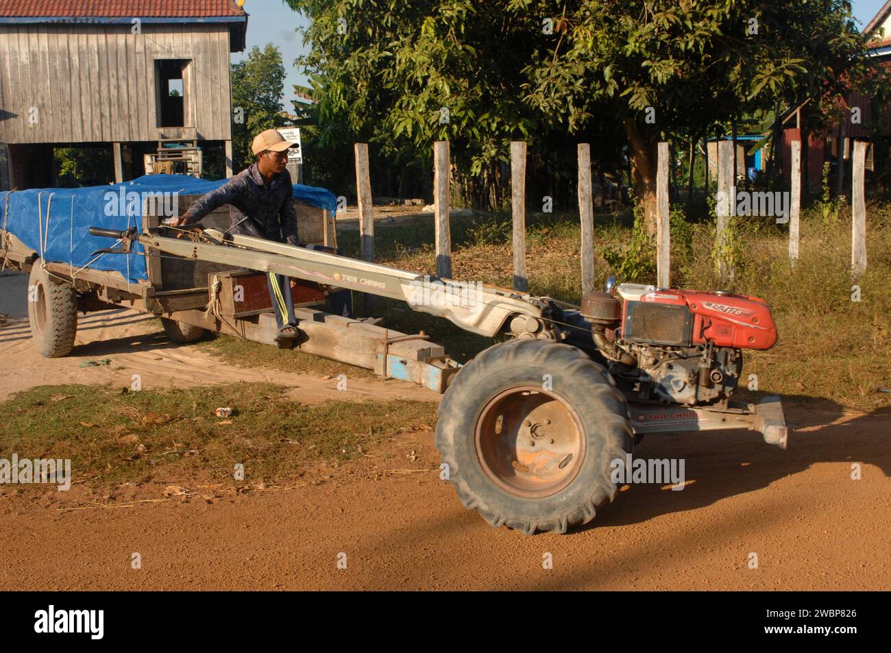 Man driving a tractor from his house, Beng Meala, Siem Reap, Cambodia ...