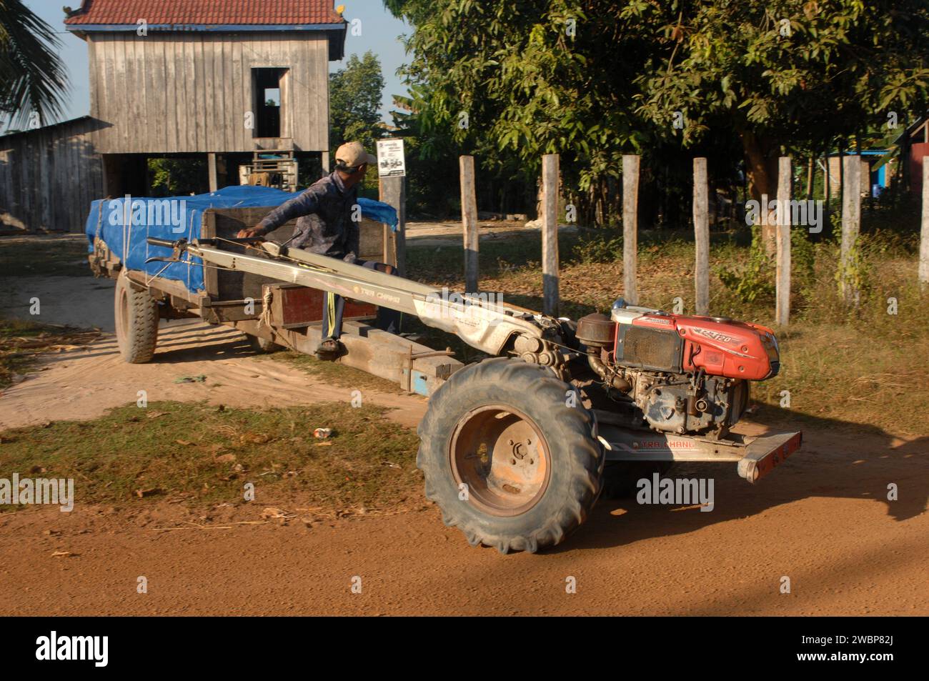 Man driving a tractor from his house, Beng Meala, Siem Reap, Cambodia ...