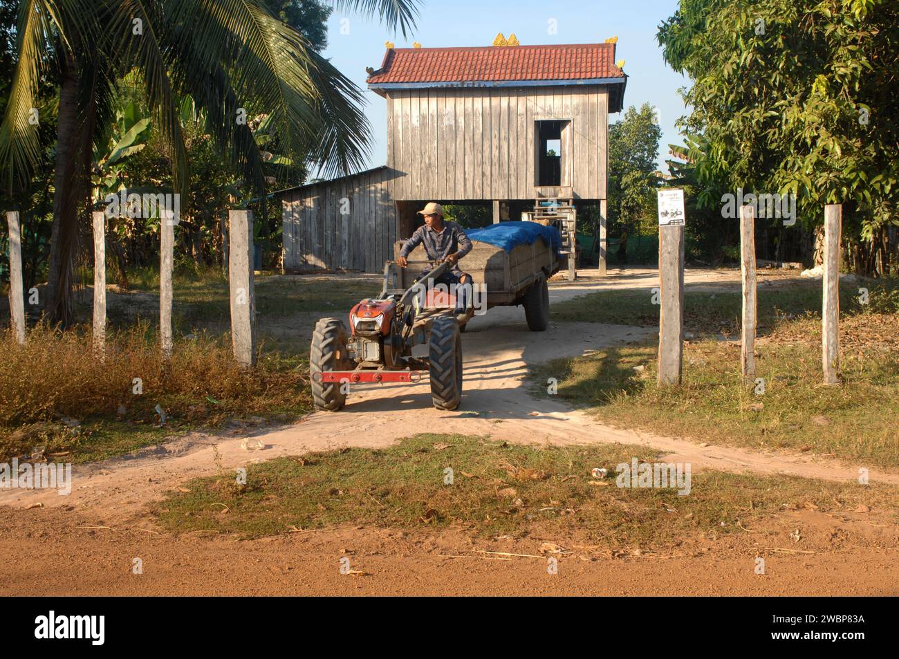 Man driving a tractor from his house, Beng Meala, Siem Reap, Cambodia ...
