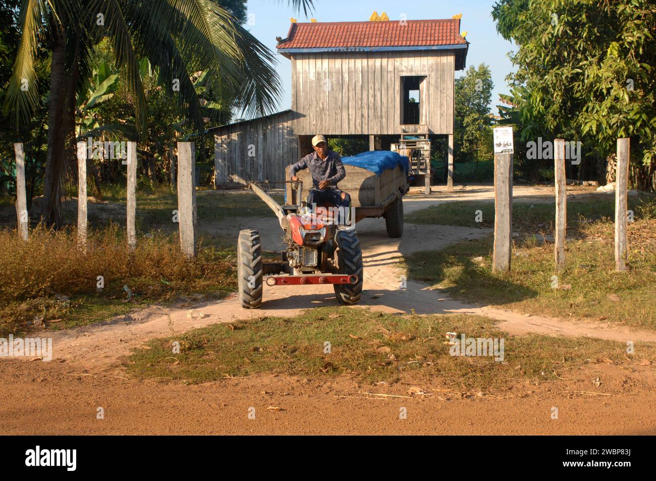Man driving a tractor from his house, Beng Meala, Siem Reap, Cambodia ...