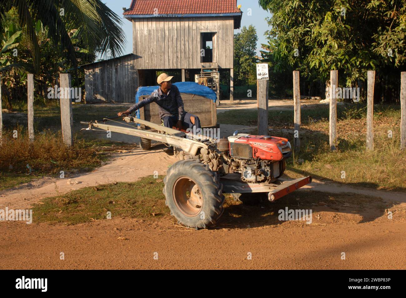 Man driving a tractor from his house, Beng Meala, Siem Reap, Cambodia ...