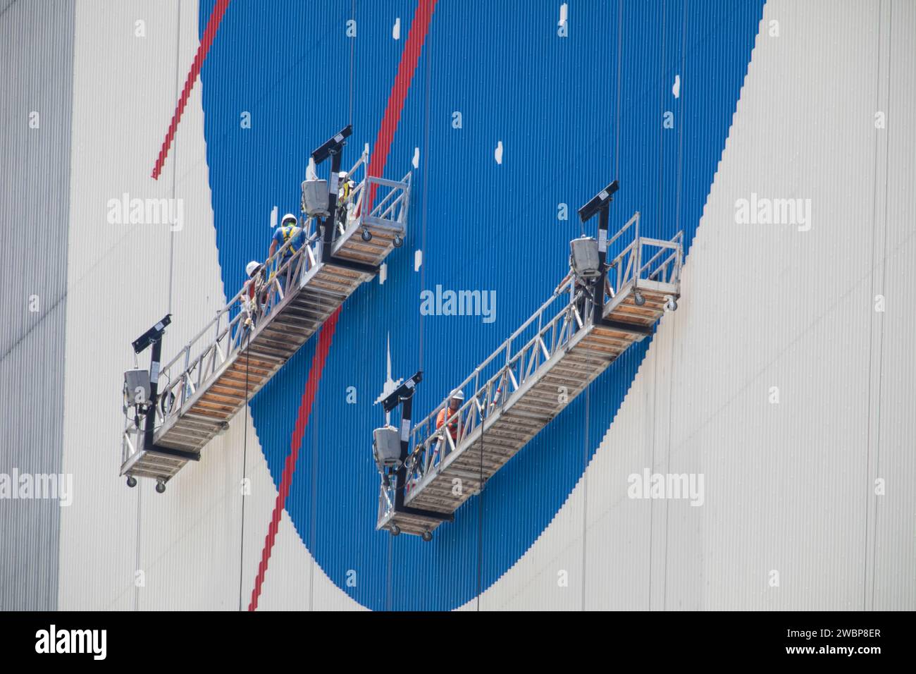 Painting of the NASA logo, also called the meatball, continues on the ...