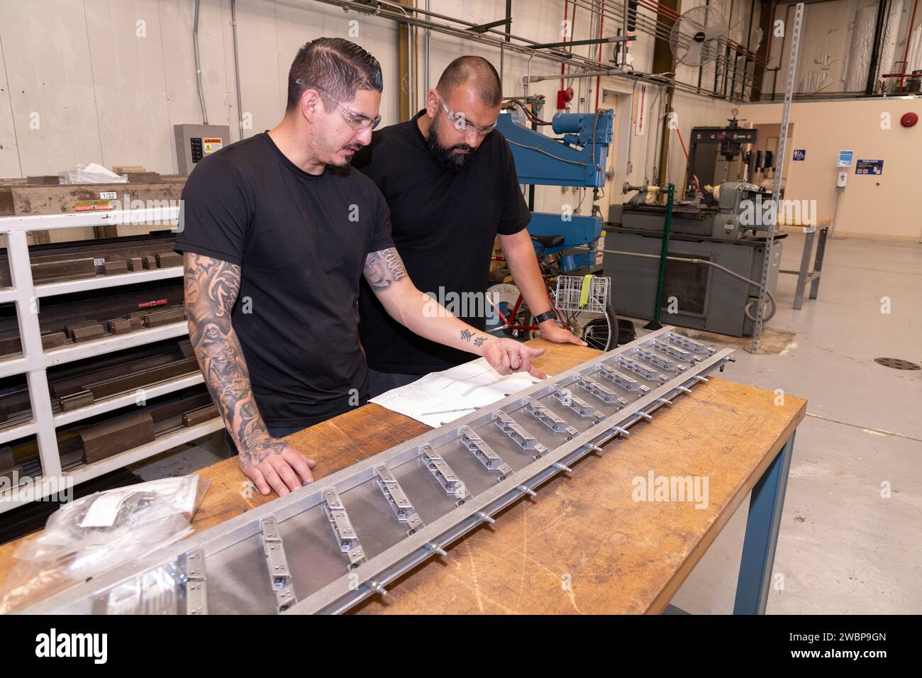 Matthew Sanchez, left, consults with Sal Navarro on assembling wing ...