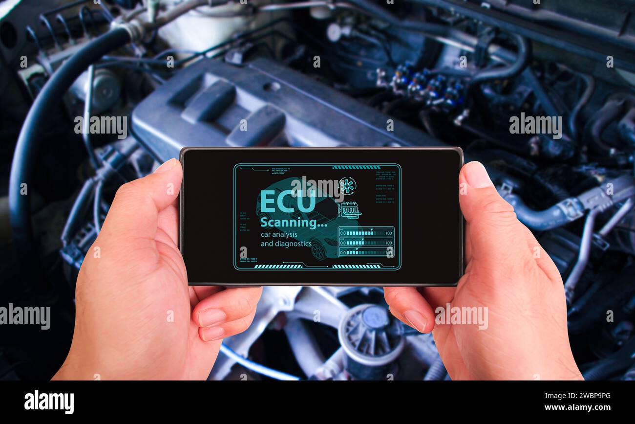 Auto mechanic checking ECU engine system with OBD2 wireless scanning ...