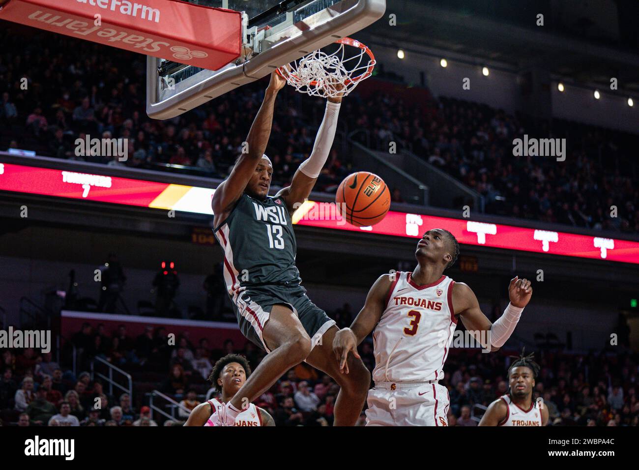 Washington State Cougars forward Isaac Jones (13) dunks against USC ... Washington State Cougars forward Isaac Jones (13) dunks against USC ...