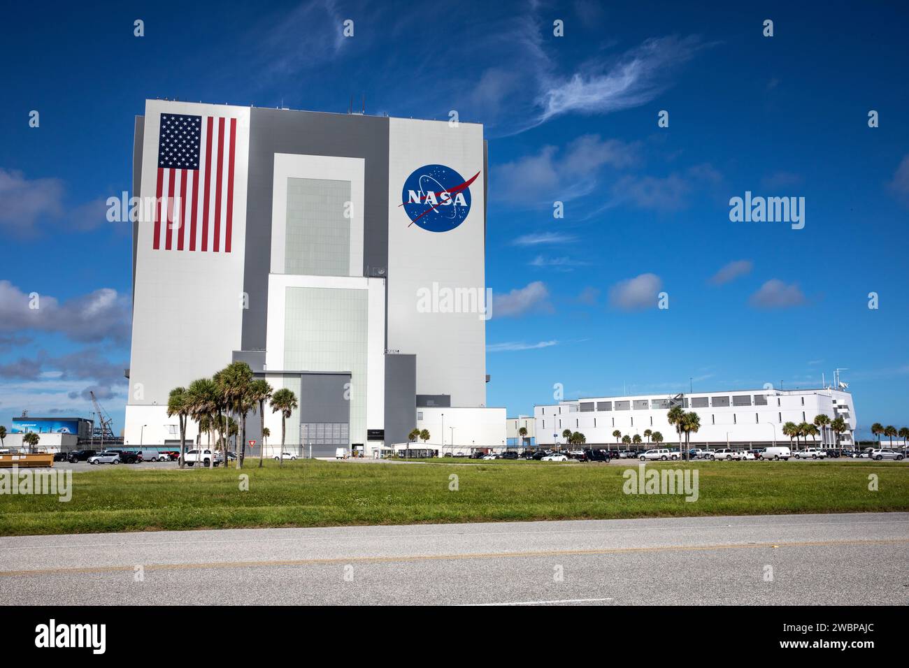 A view of the Vehicle Assembly Building (VAB) with a vibrant NASA logo ...