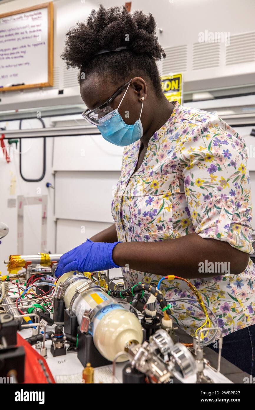 Technicians wearing protective equipment perform work for a future ...