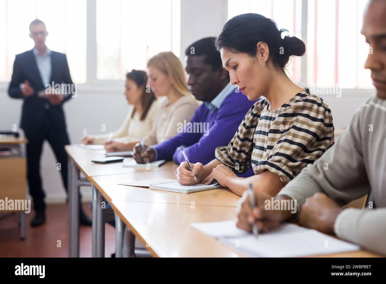 Focused japanese woman listening lecture at adult education class Stock ...