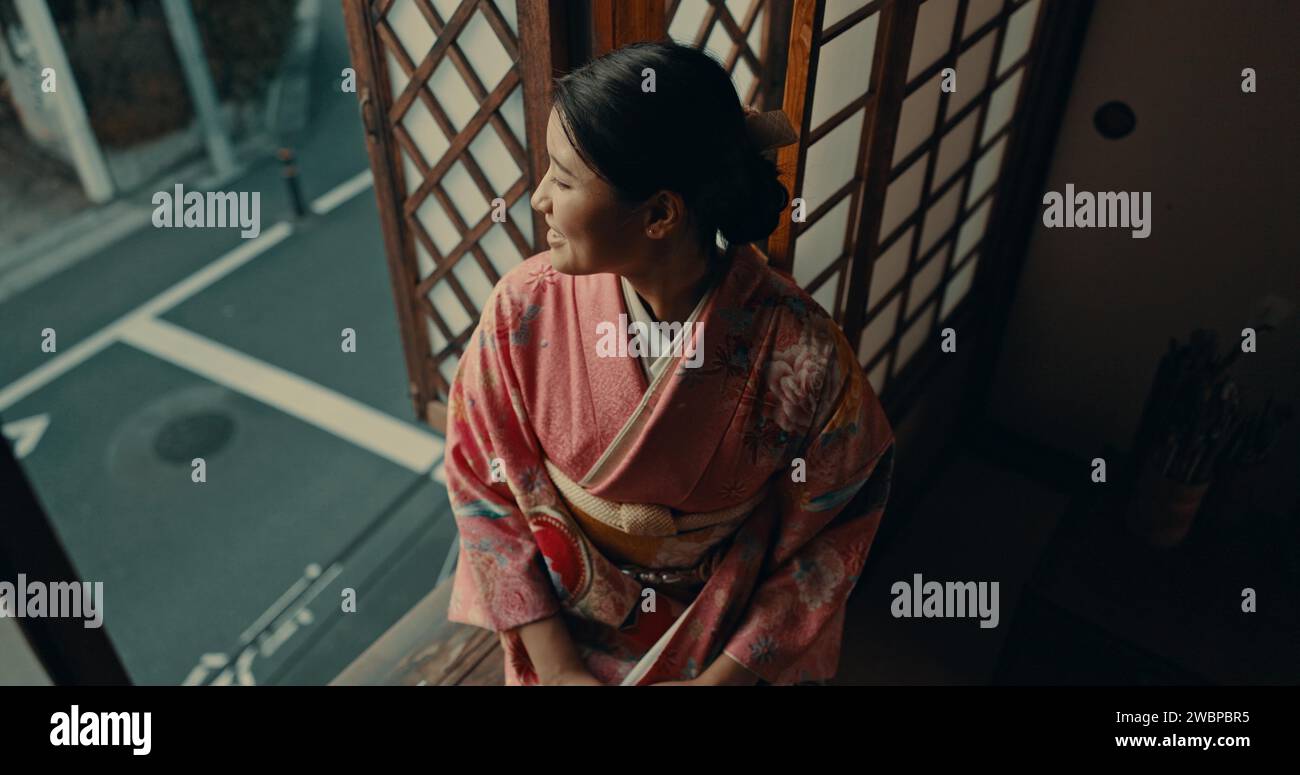 Japanese woman, window view and traditional clothes in home for vision ...