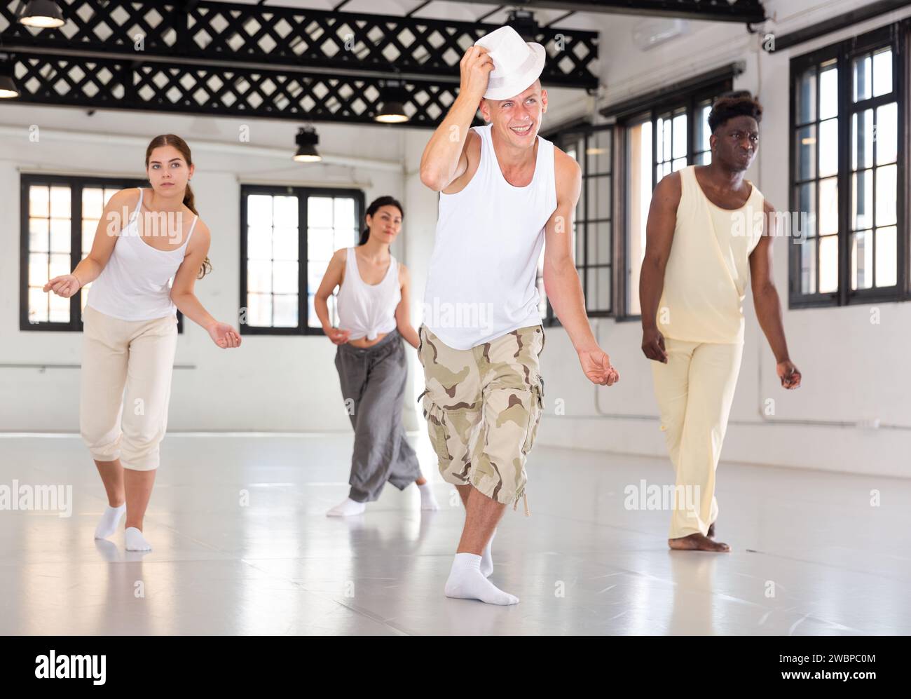 Group of young people learning modern dance movements Stock Photo - Alamy