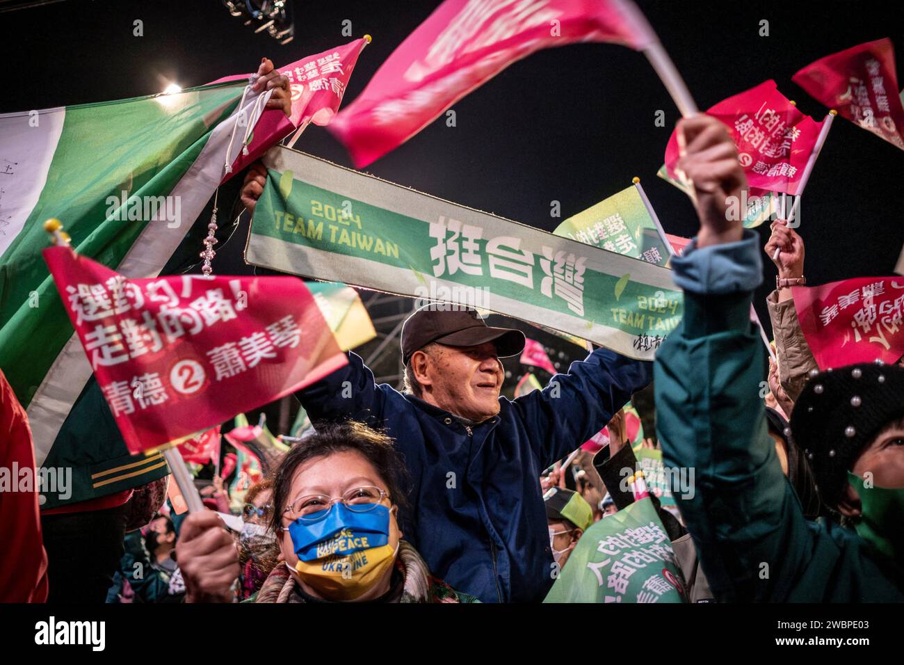 Taiwan, Jan 11, 2024. A supporter showed his banner during the TPP ...